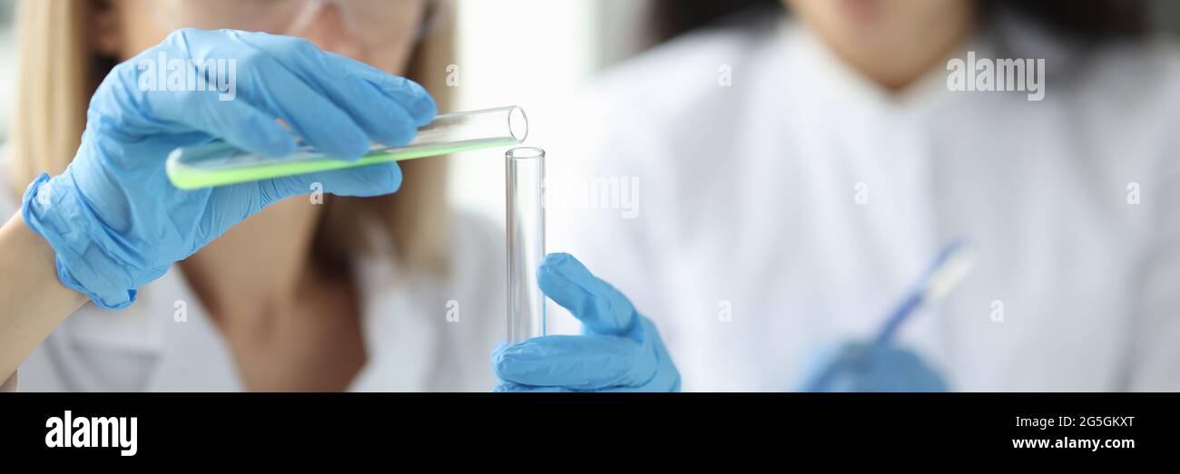 Scientists in laboratory are conducting chemical experiments Stock ...