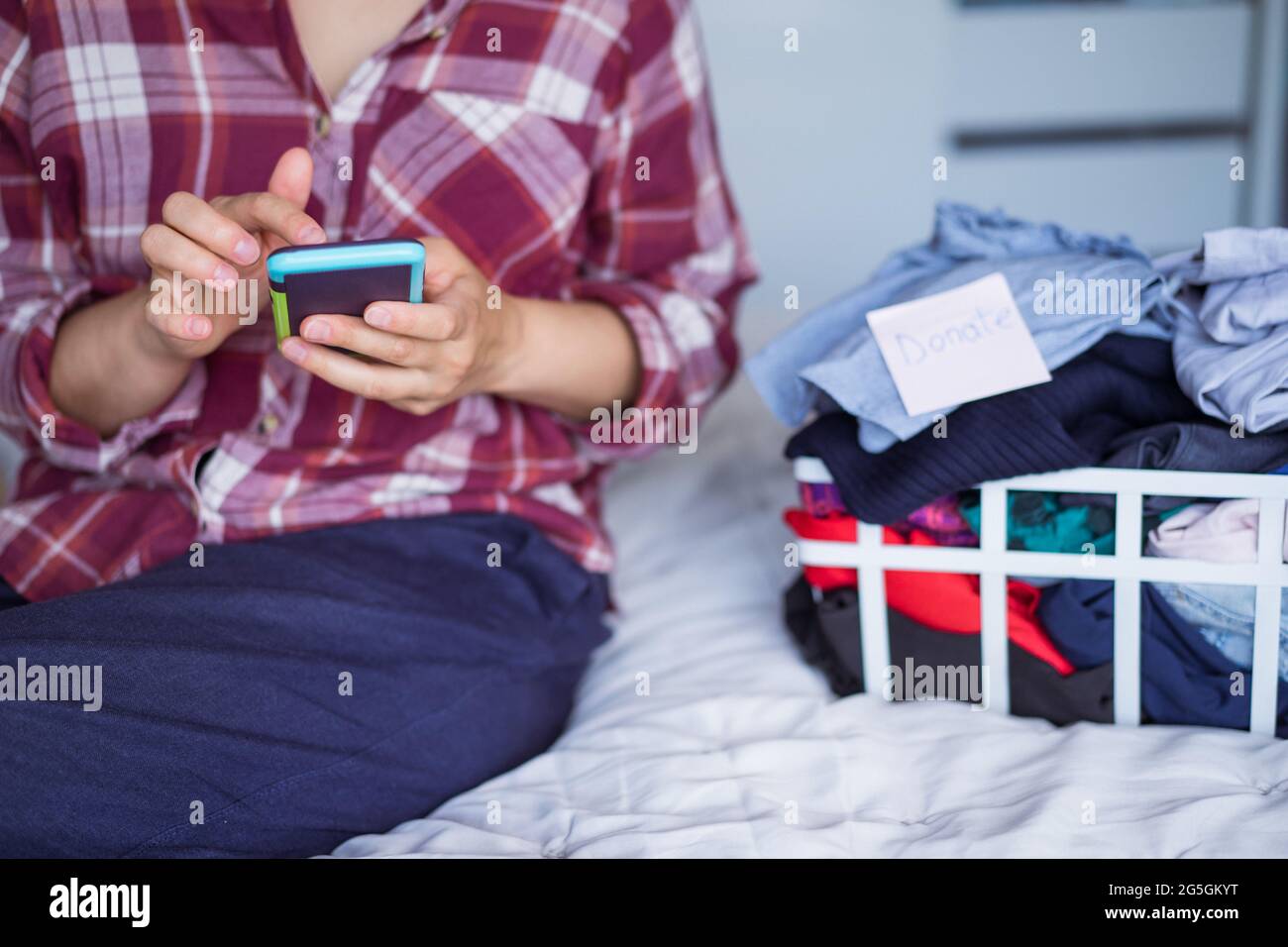 Woman sorting clothes home hi-res stock photography and images - Alamy