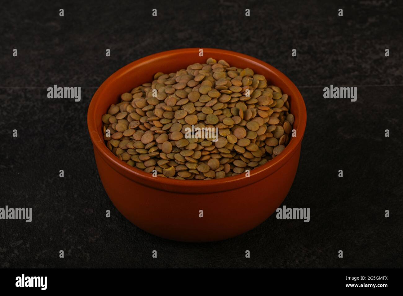 Vegan cuisine - Dry lentil heap isolated Stock Photo - Alamy