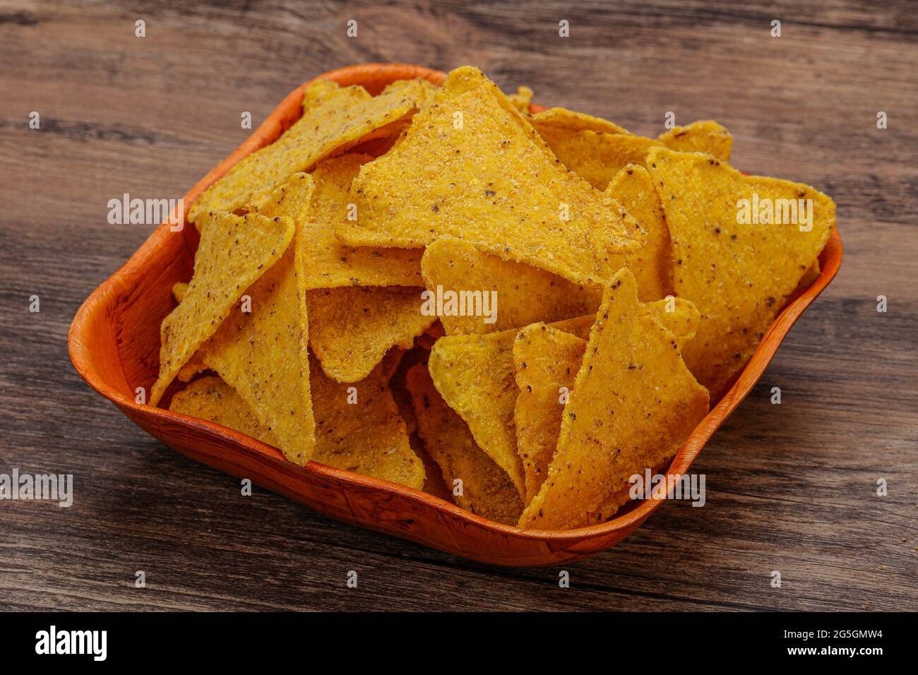 Mexican crunchy corn nachos triangle heap Stock Photo - Alamy
