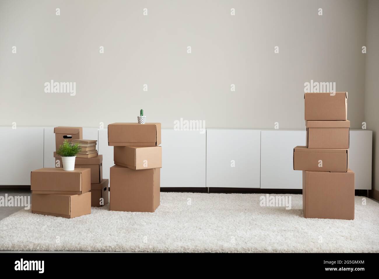 Cardboard boxes in new rental room or house Stock Photo - Alamy