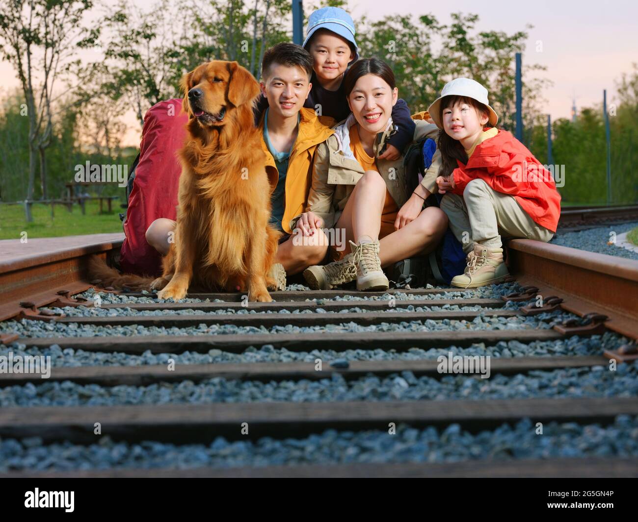 Happy family of four and pet dog in outdoor photo high quality photo ...