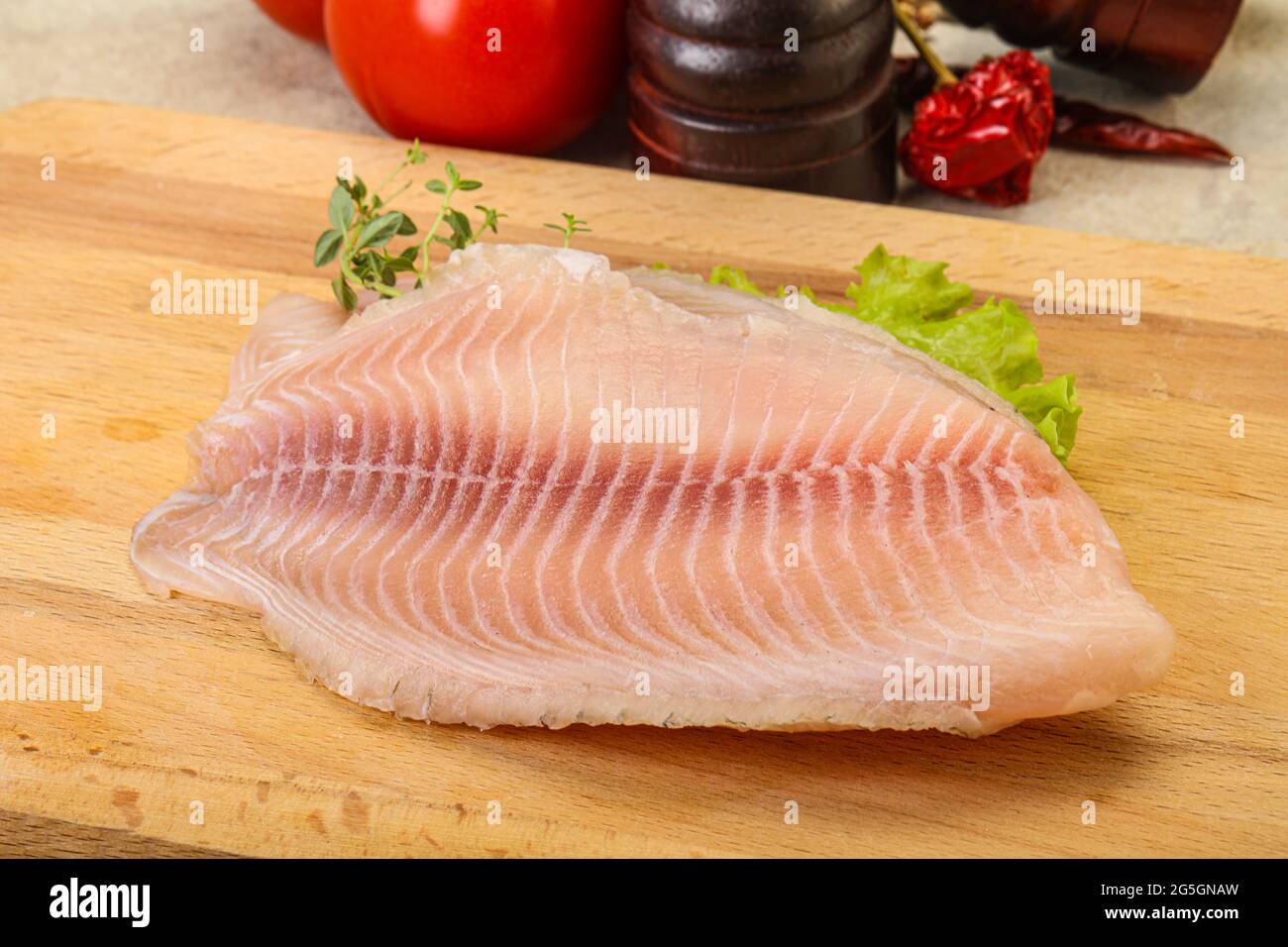 Raw tilapia fish fillet for cooking Stock Photo - Alamy