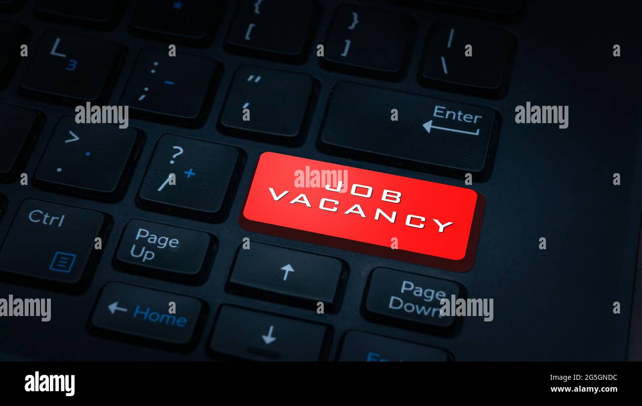 a red JOB VACANCY button on dark keyboard background - application job ...