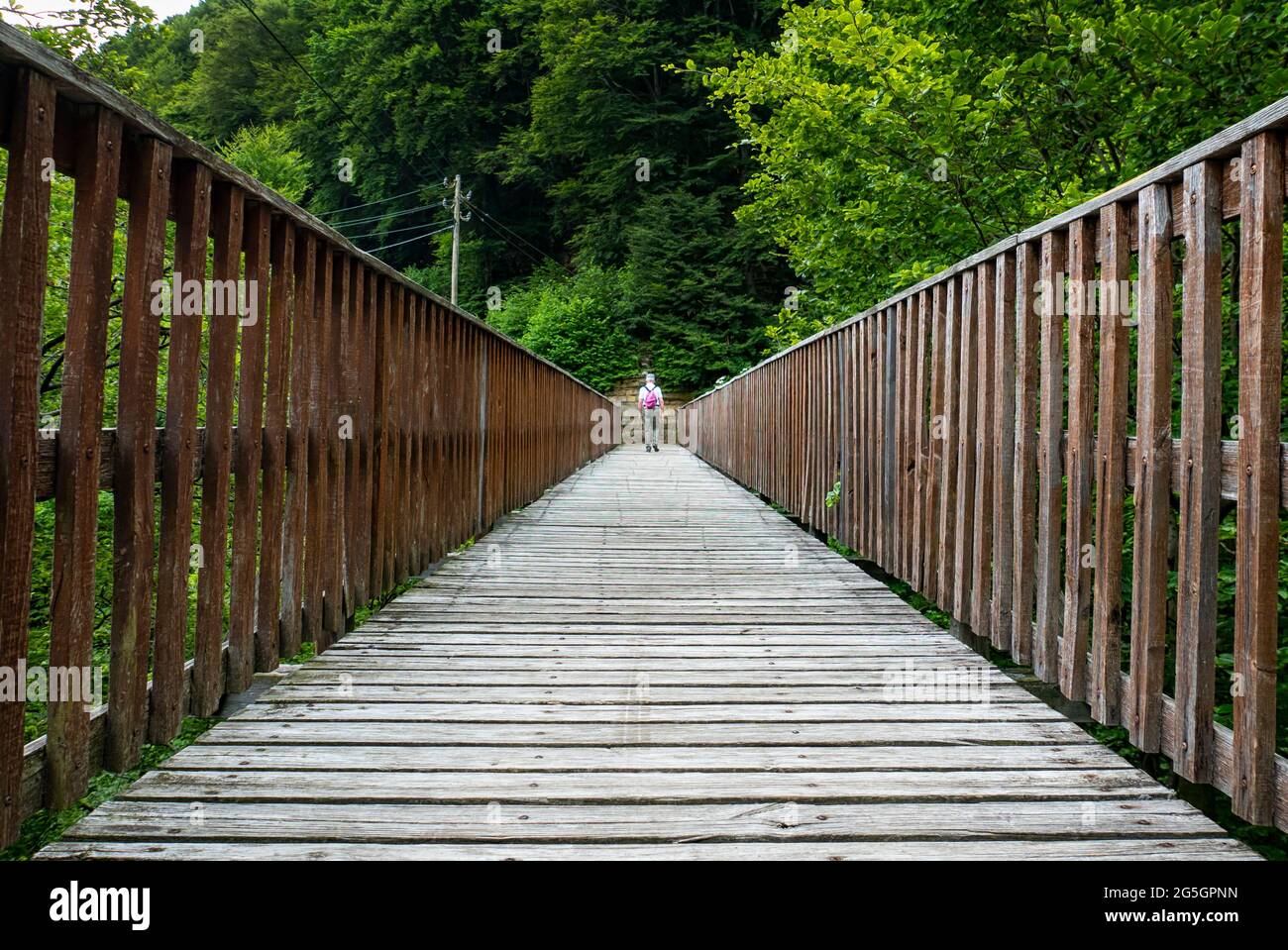 Wood bridge perspective in the italian alps Stock Photo - Alamy
