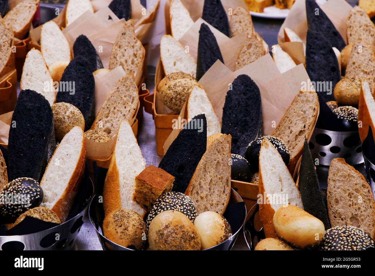 assorted breads in a basket, multi colored bread slices Stock Photo - Alamy