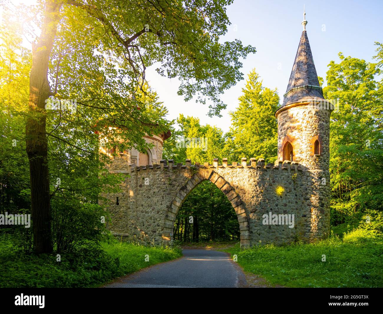 Gothic arc gate over asphalt road Stock Photo - Alamy