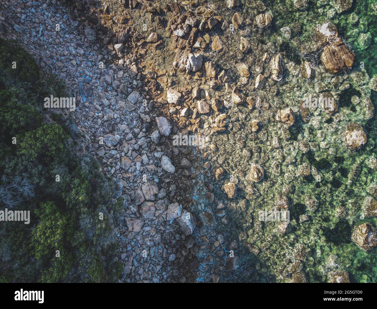 An aerial top view of rocky shore Stock Photo - Alamy