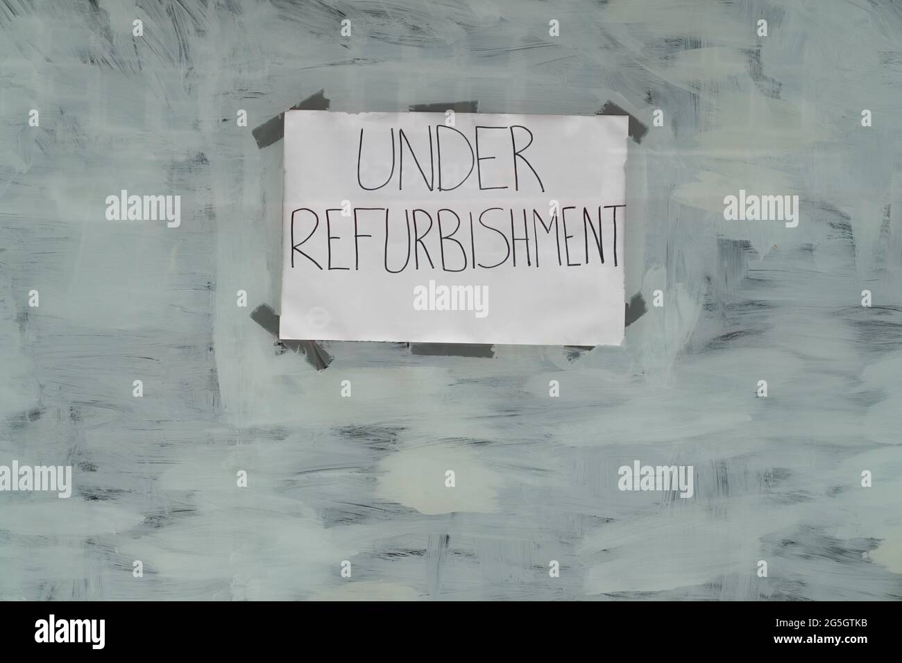 Under refurbishment sign on a blocked out shop window Stock Photo - Alamy
