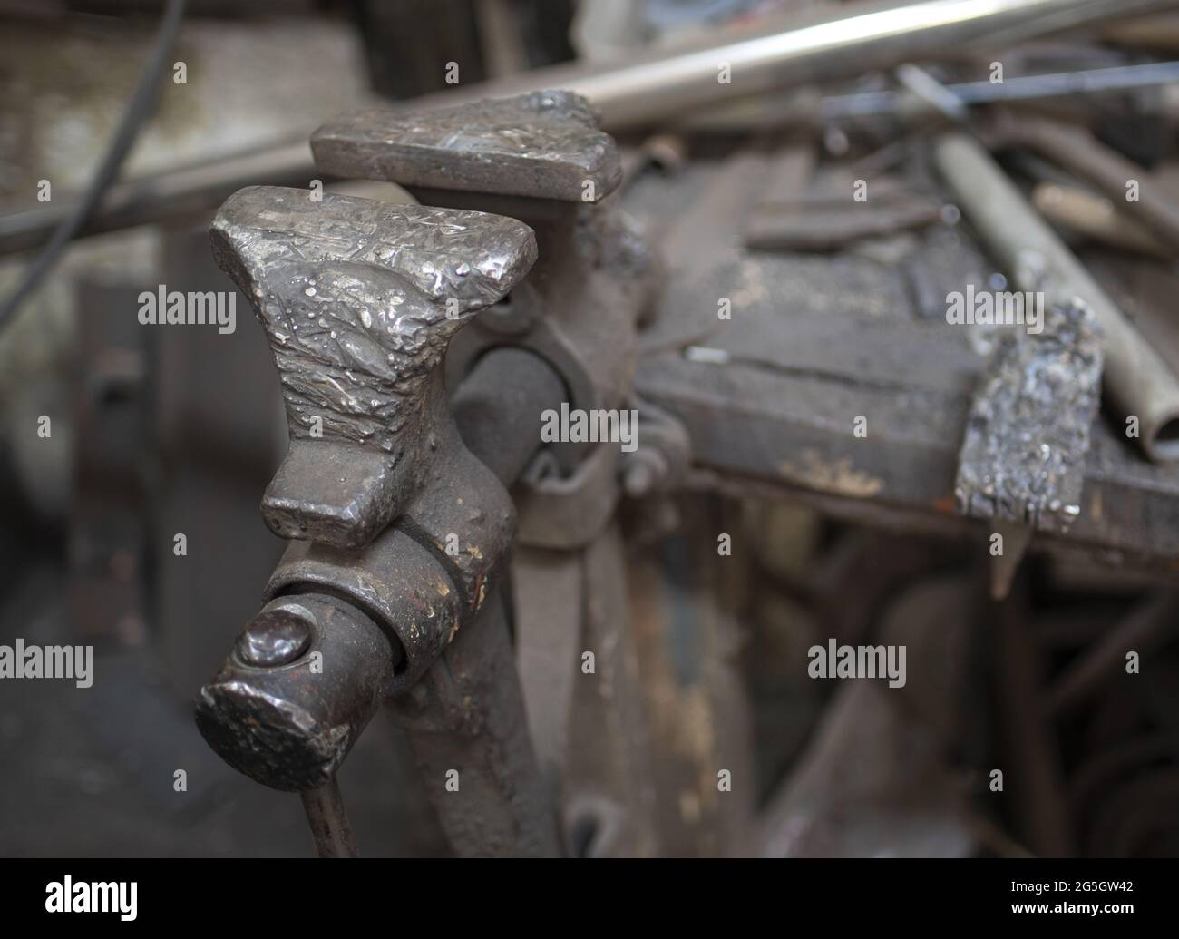 An old bench vise in a smithy Stock Photo - Alamy