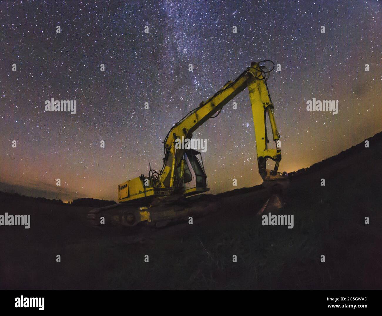The large yellow industrial machinery under a starry night sky Stock ...