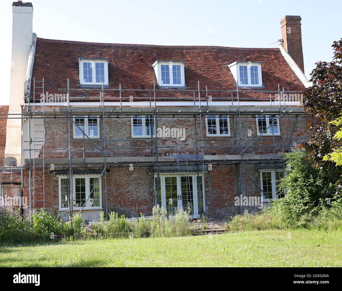 Scaffolding seen against a building in the UK Stock Photo - Alamy