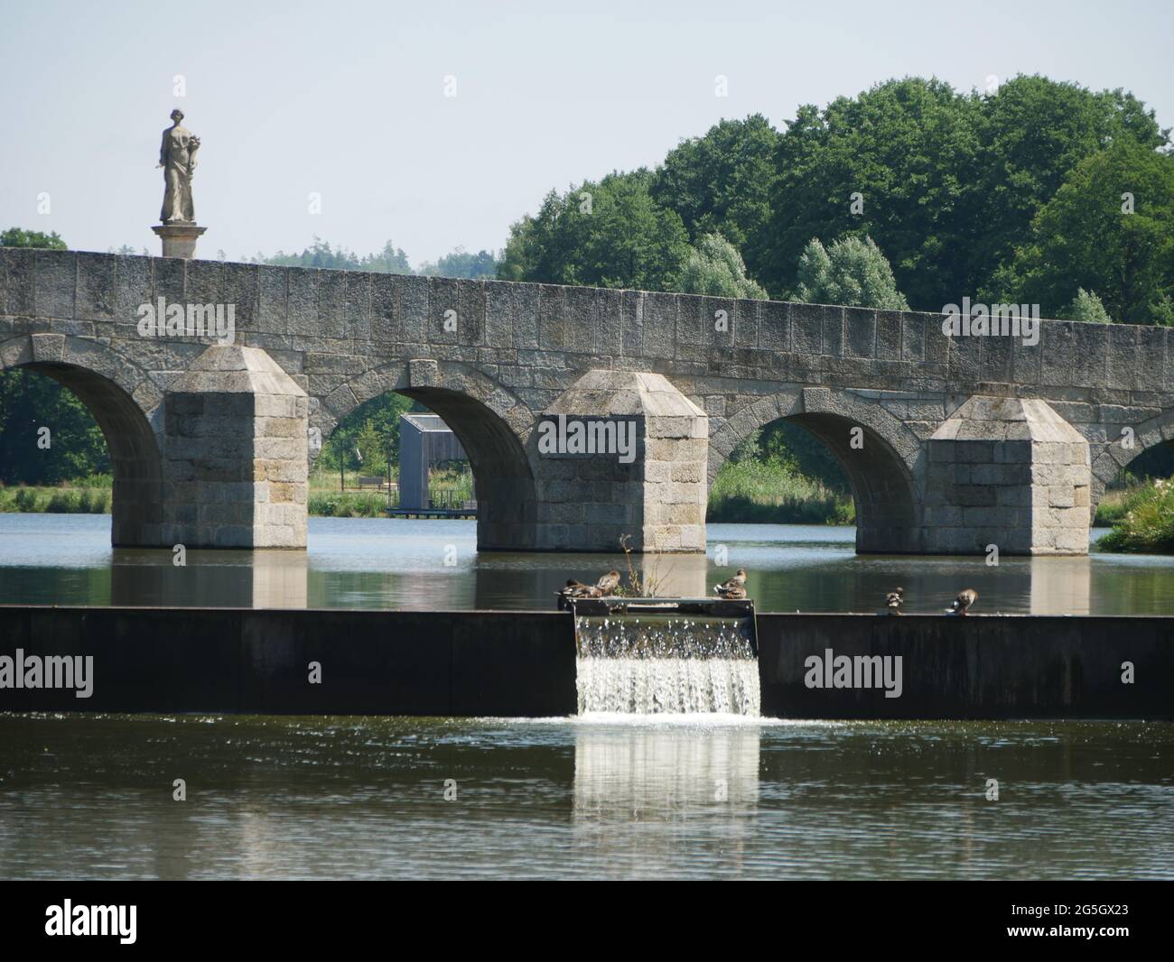 A beautiful view of the bridge over the river and the houses in the ...