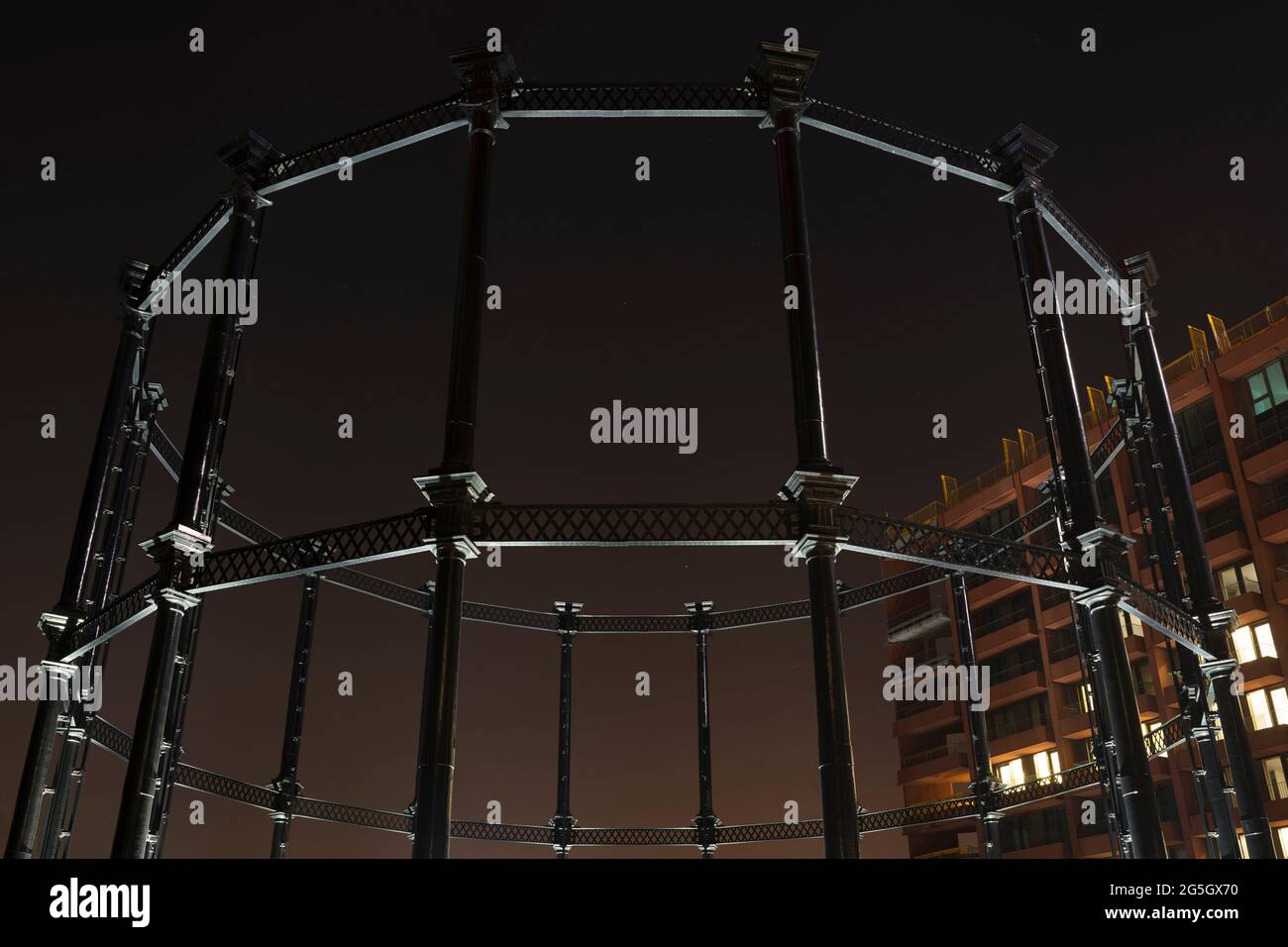 Illuminated gasholder structure. Gasholder Park, London, United Kingdom ...