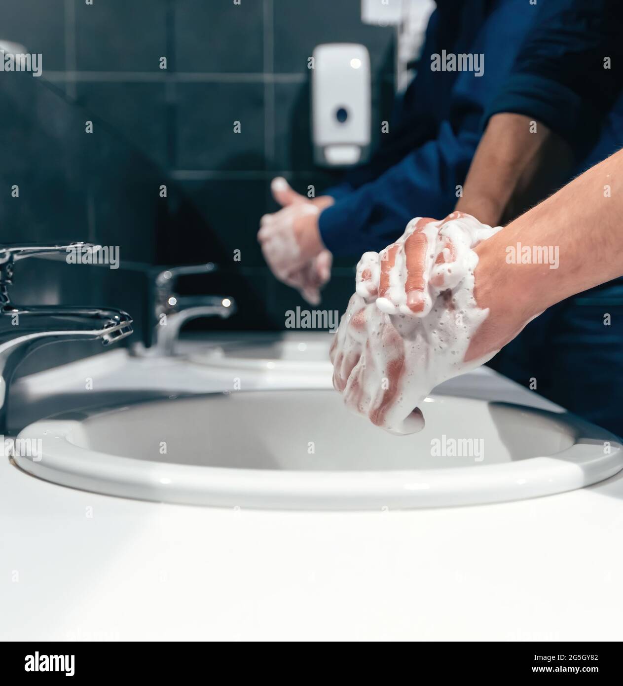 close up. employees wash their hands thoroughly Stock Photo - Alamy