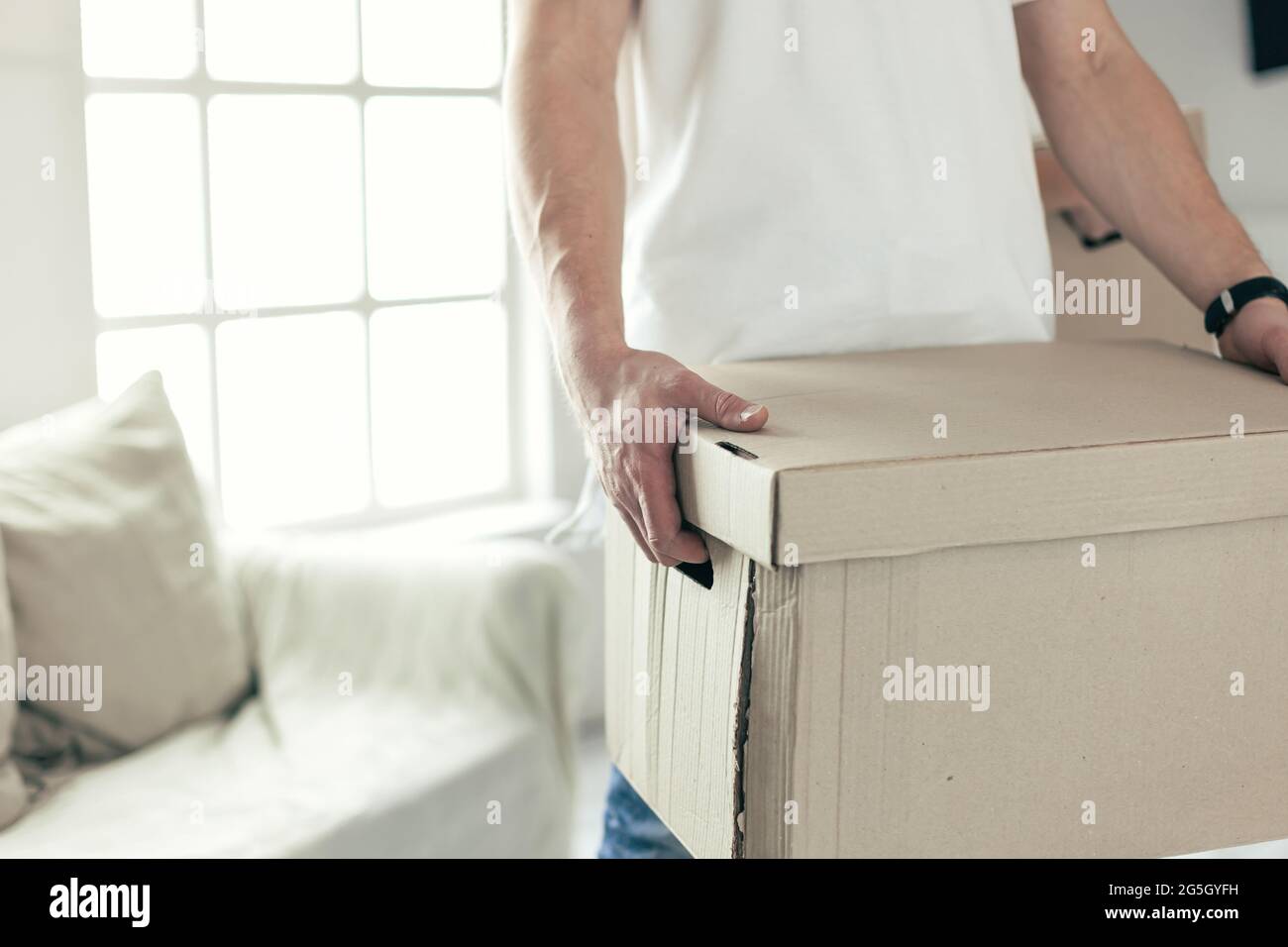 Man Carrying A Big Box High Resolution Stock Photography and Images - Alamy