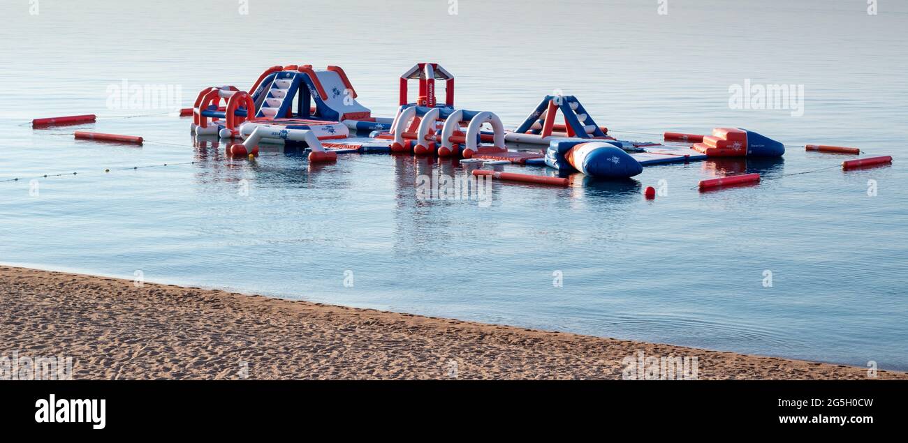 An inflatable water park near the beach Stock Photo - Alamy