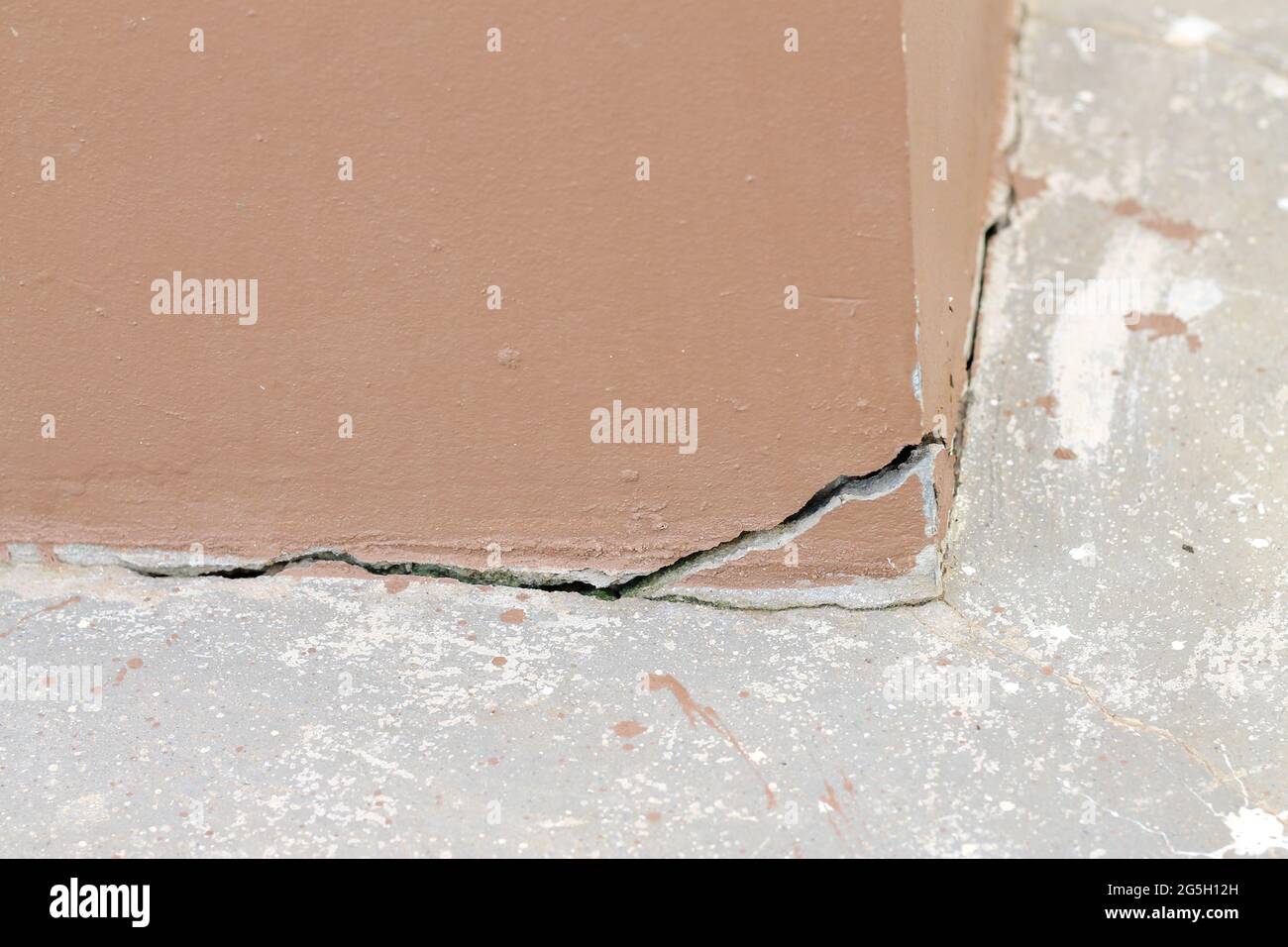 Deep cracks and holes in the exterior concrete wall old brown wall ...