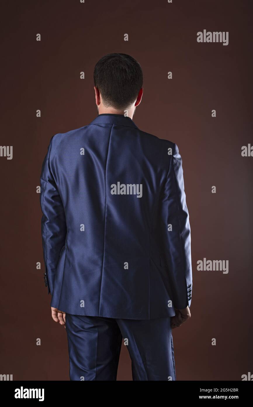 A vertical back view of a male businessman Stock Photo - Alamy