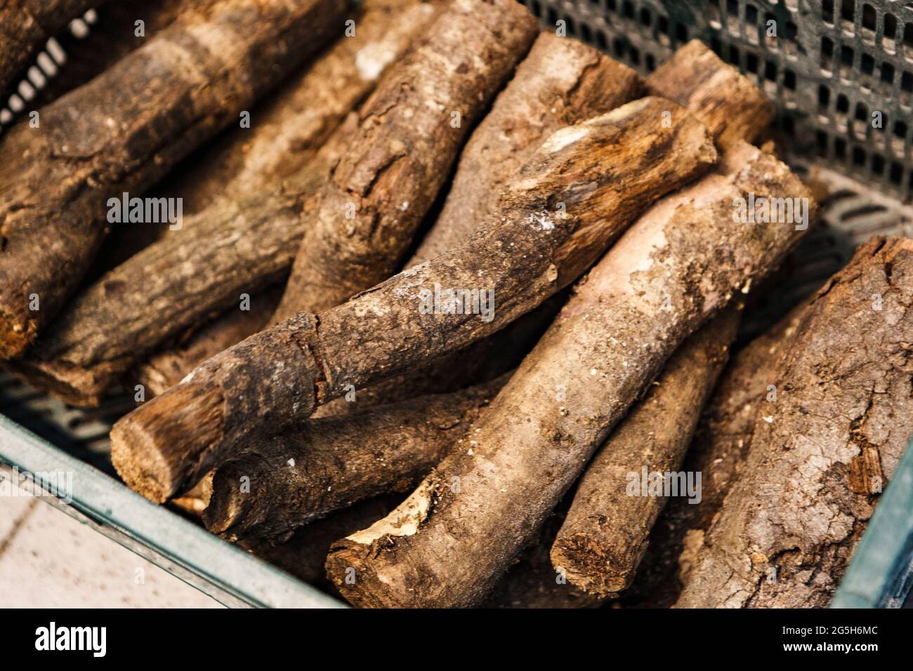 logs of firewood for oven in plastic box Stock Photo - Alamy