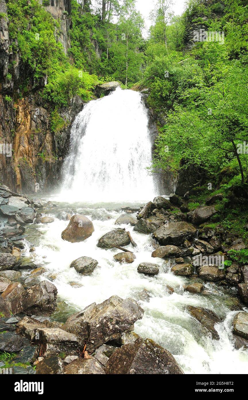 A picturesque view of a powerful waterfall flowing down from the ...