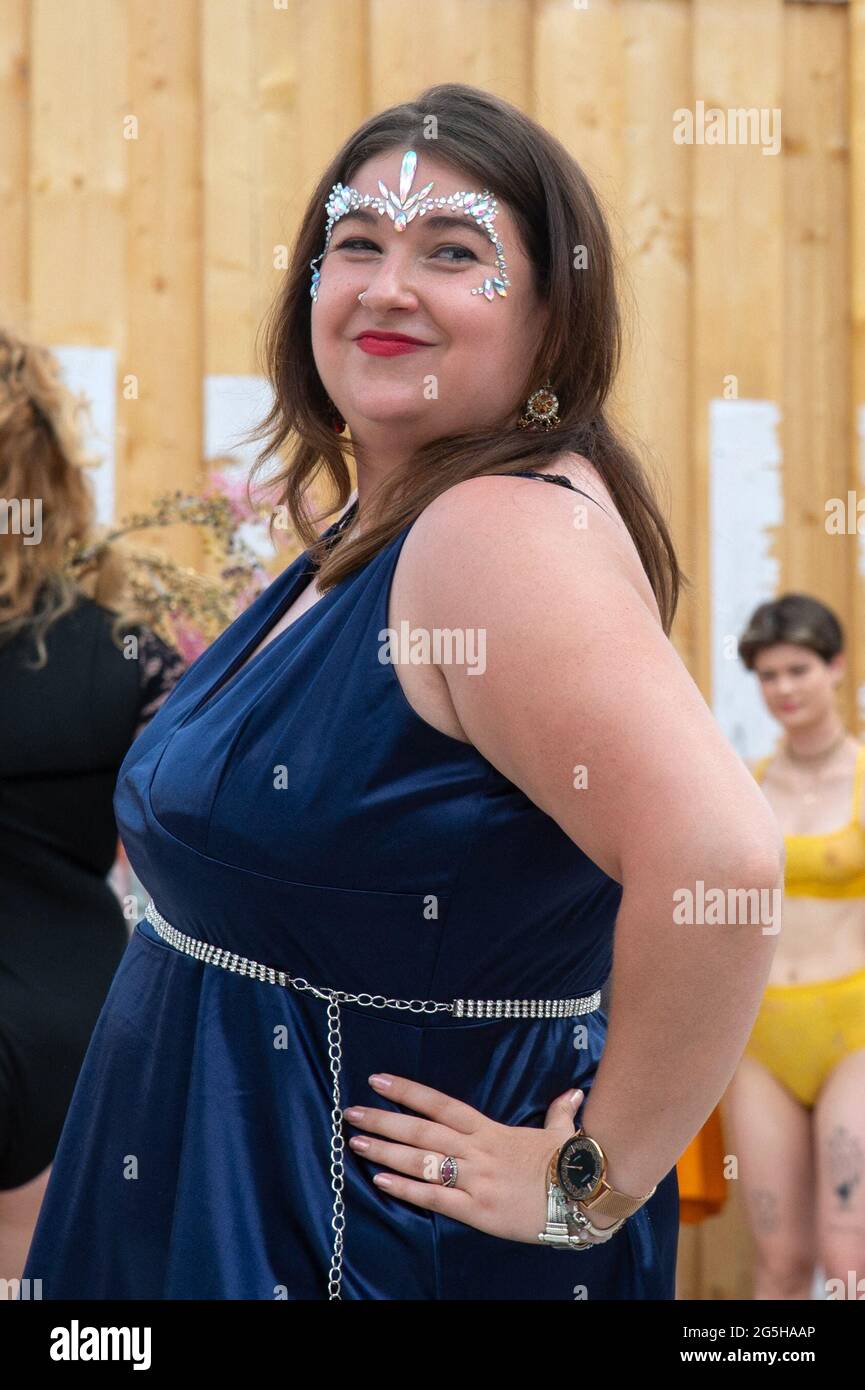 A model walks on the runway during the All Sizes Catwalk show as part ...
