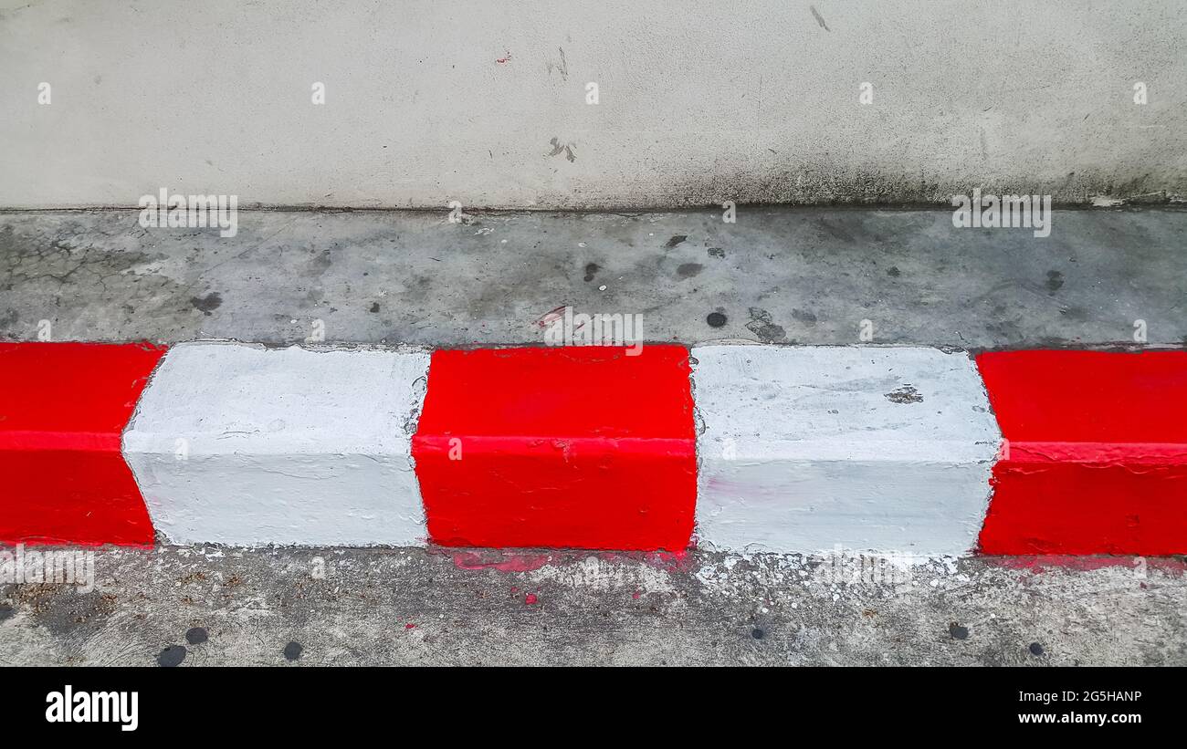 Red and White sign on the sidewalk background Stock Photo - Alamy