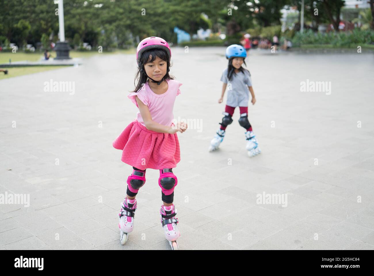 asian girl going on her in-line skates Stock Photo - Alamy