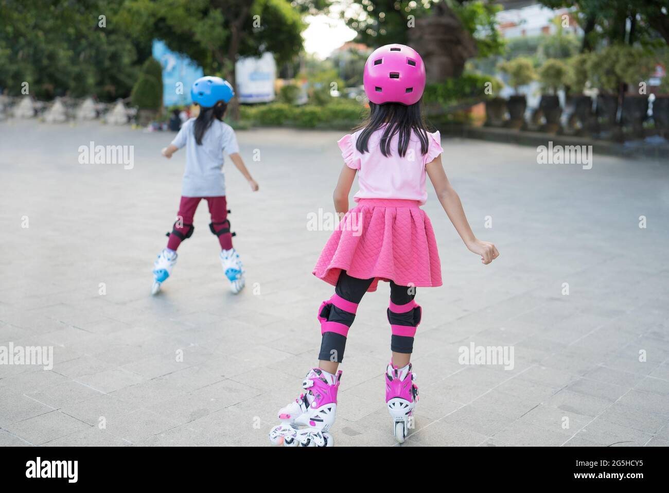asian girl going on her in-line skates Stock Photo - Alamy