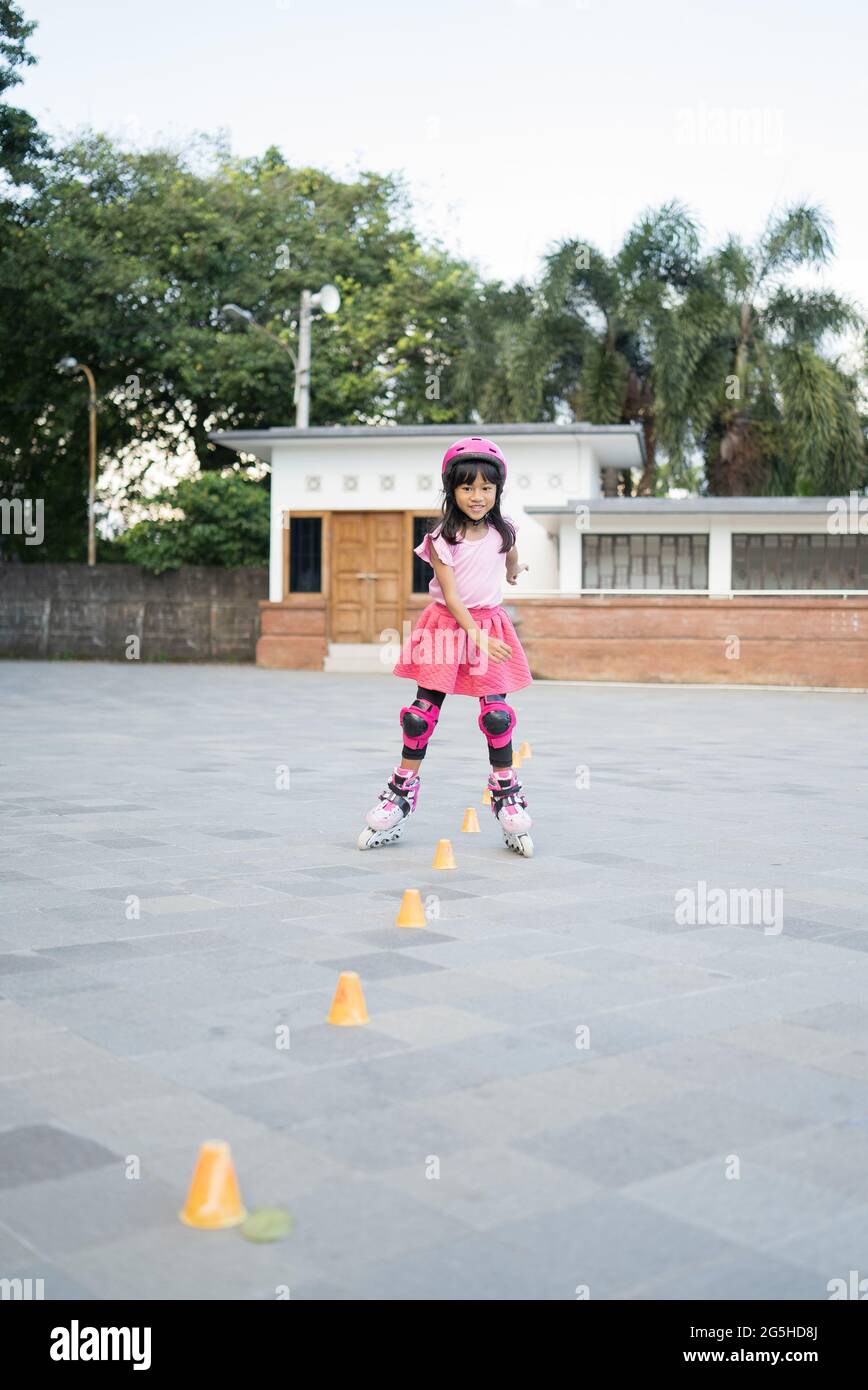 asian girl going on her in-line skates Stock Photo - Alamy