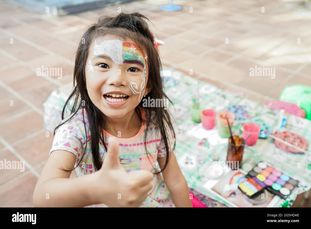 asian Child preschooler with face painting. Make up Stock Photo - Alamy