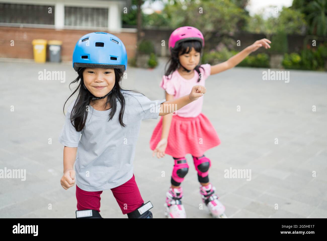 asian girl going on her in-line skates Stock Photo - Alamy