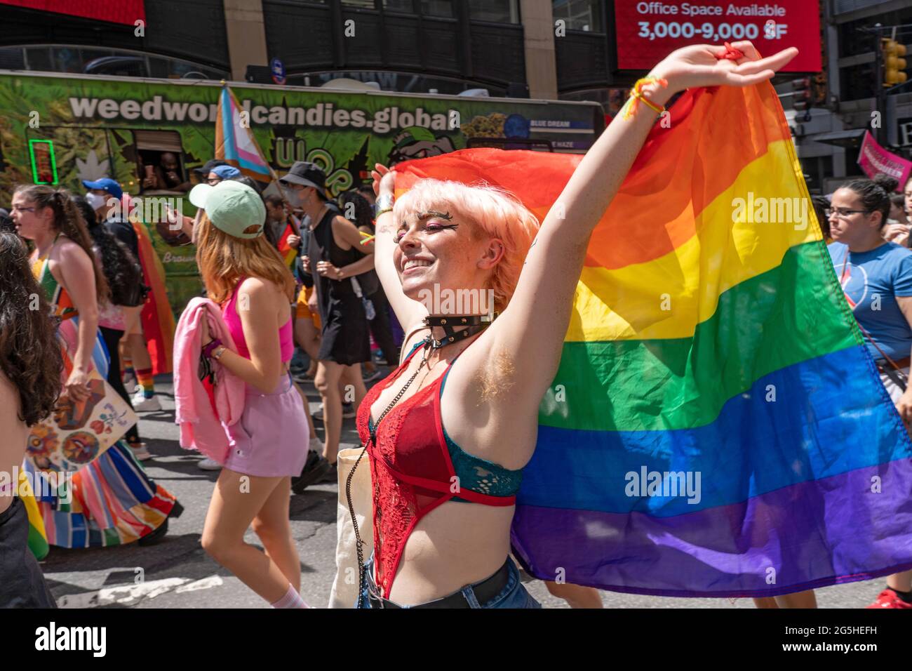 Marchers with pride flags participate in the Queer Liberation March in ...