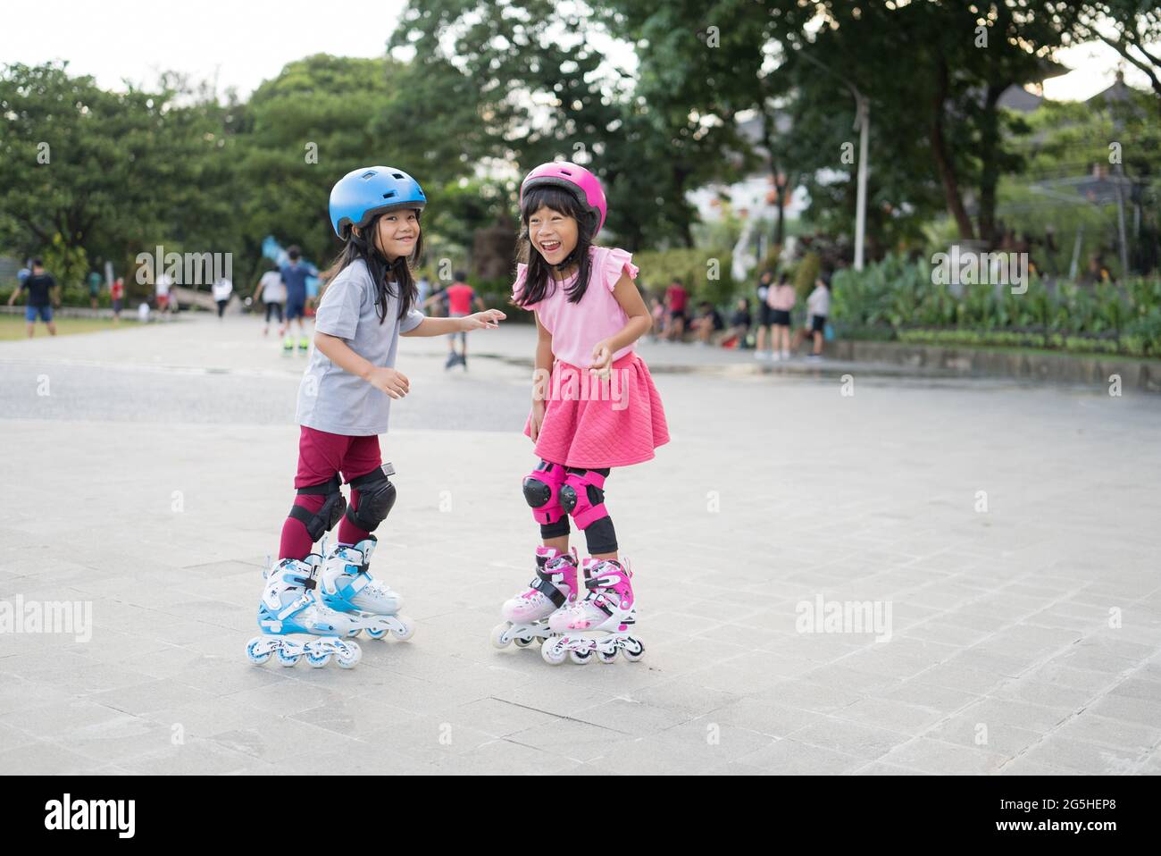 asian girl going on her in-line skates Stock Photo - Alamy