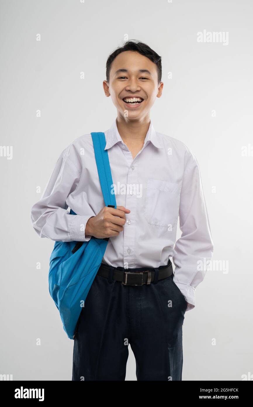 Boy carrying a schoolbag hi-res stock photography and images - Alamy