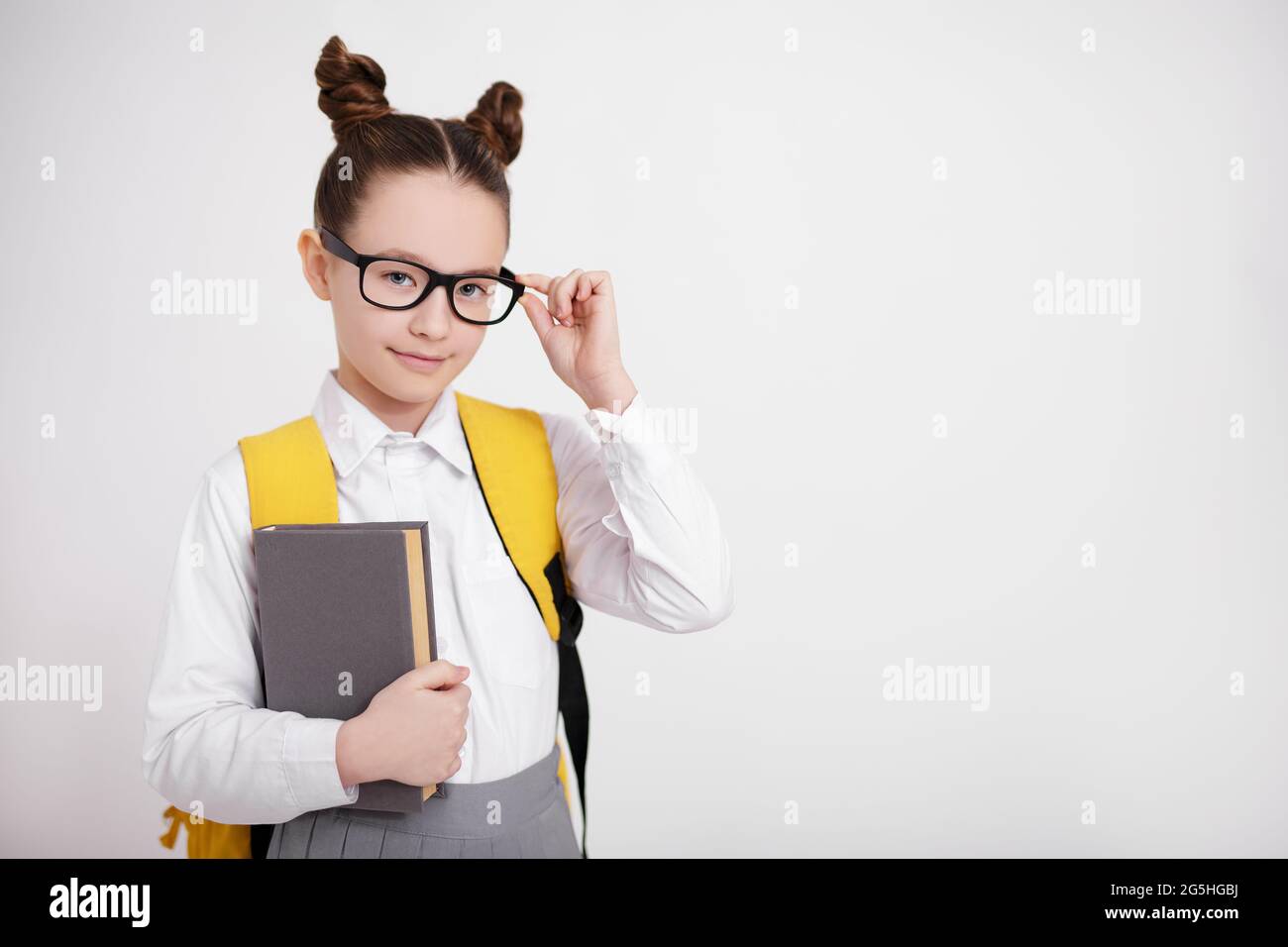 education and eyevision concept - portrait of cute girl in school ...