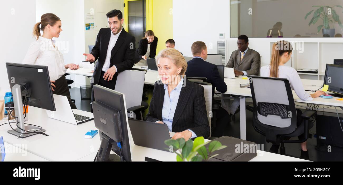 Business people working in open plan office Stock Photo - Alamy
