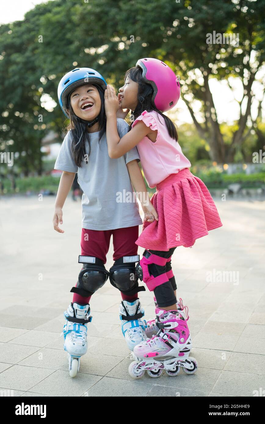 asian girl going on her in-line skates Stock Photo - Alamy