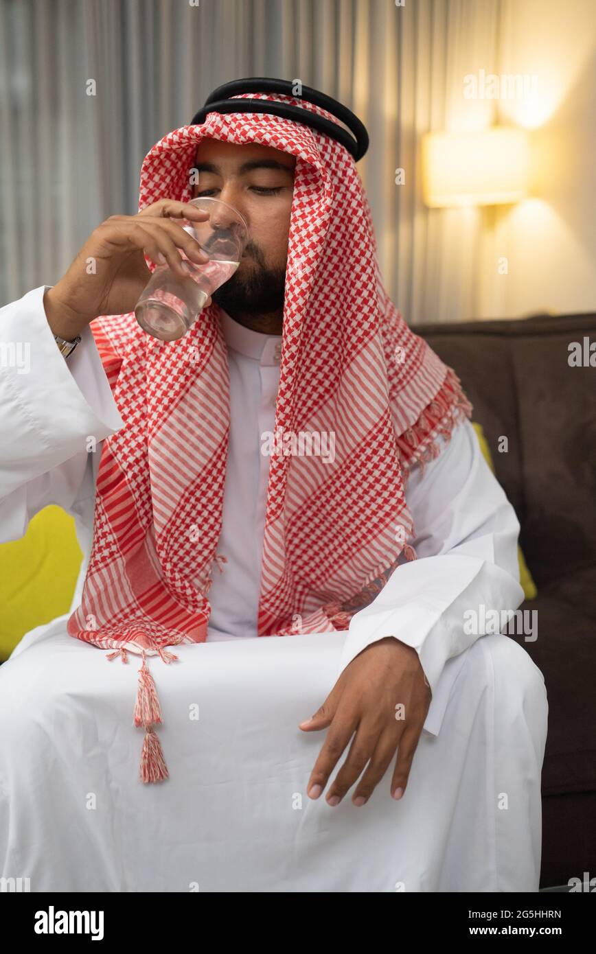 Saudi men drinking hi-res stock photography and images - Alamy