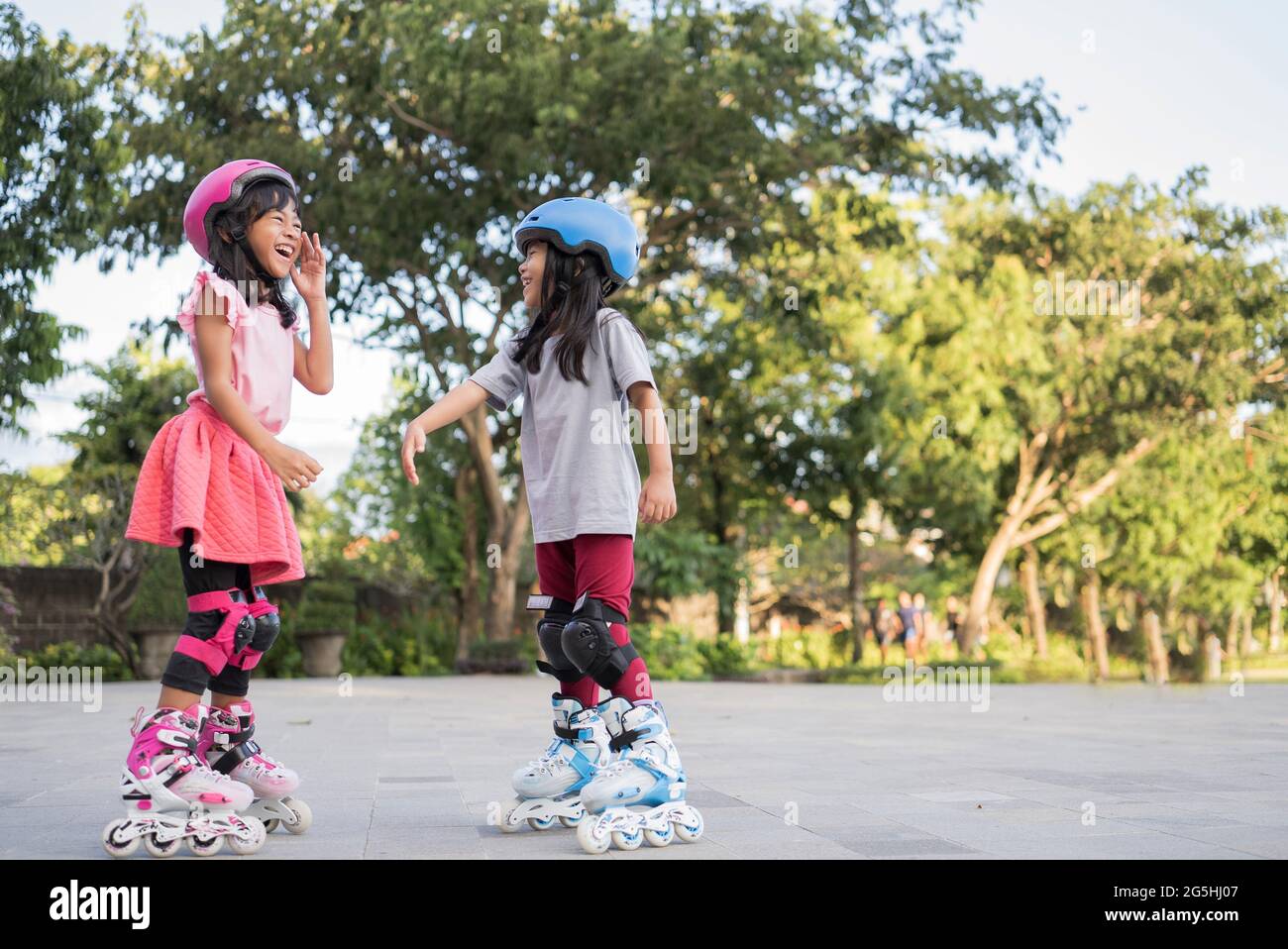 asian girl going on her in-line skates Stock Photo - Alamy