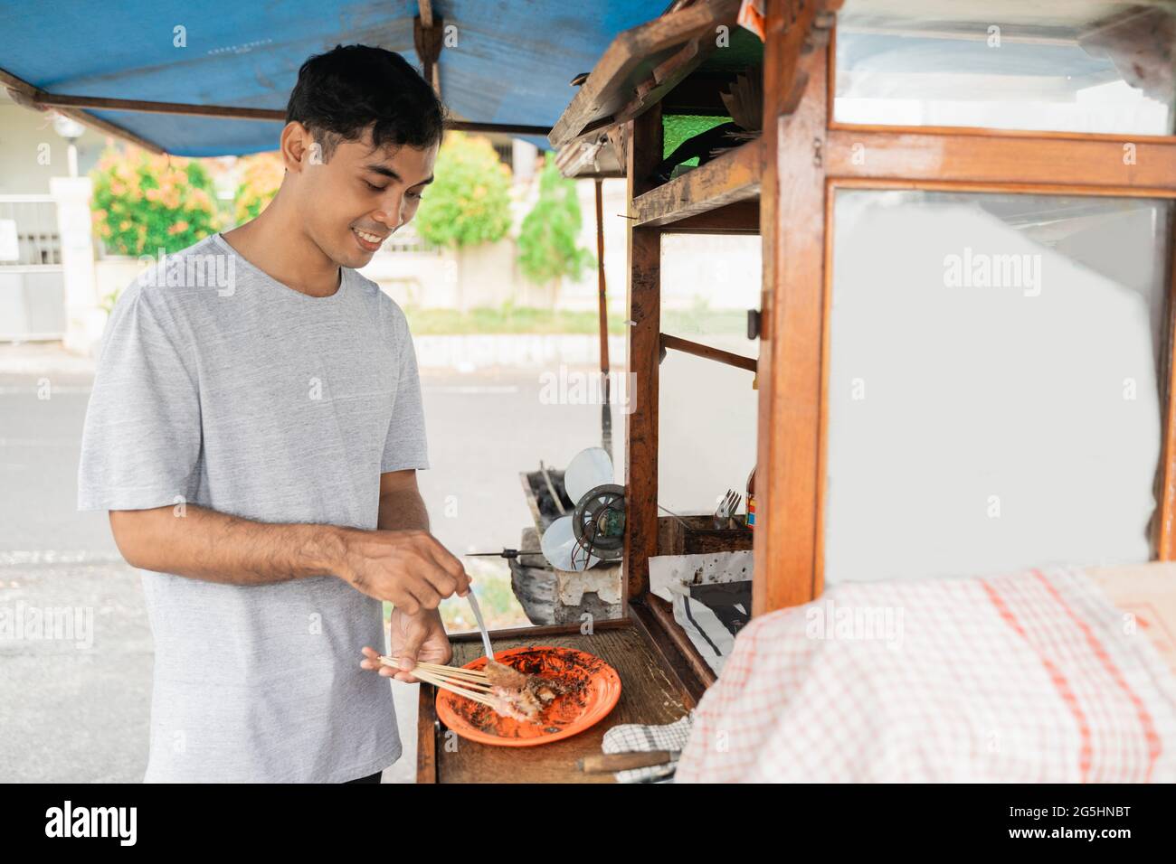 traditional food seller preparing the meal for customer Stock Photo - Alamy