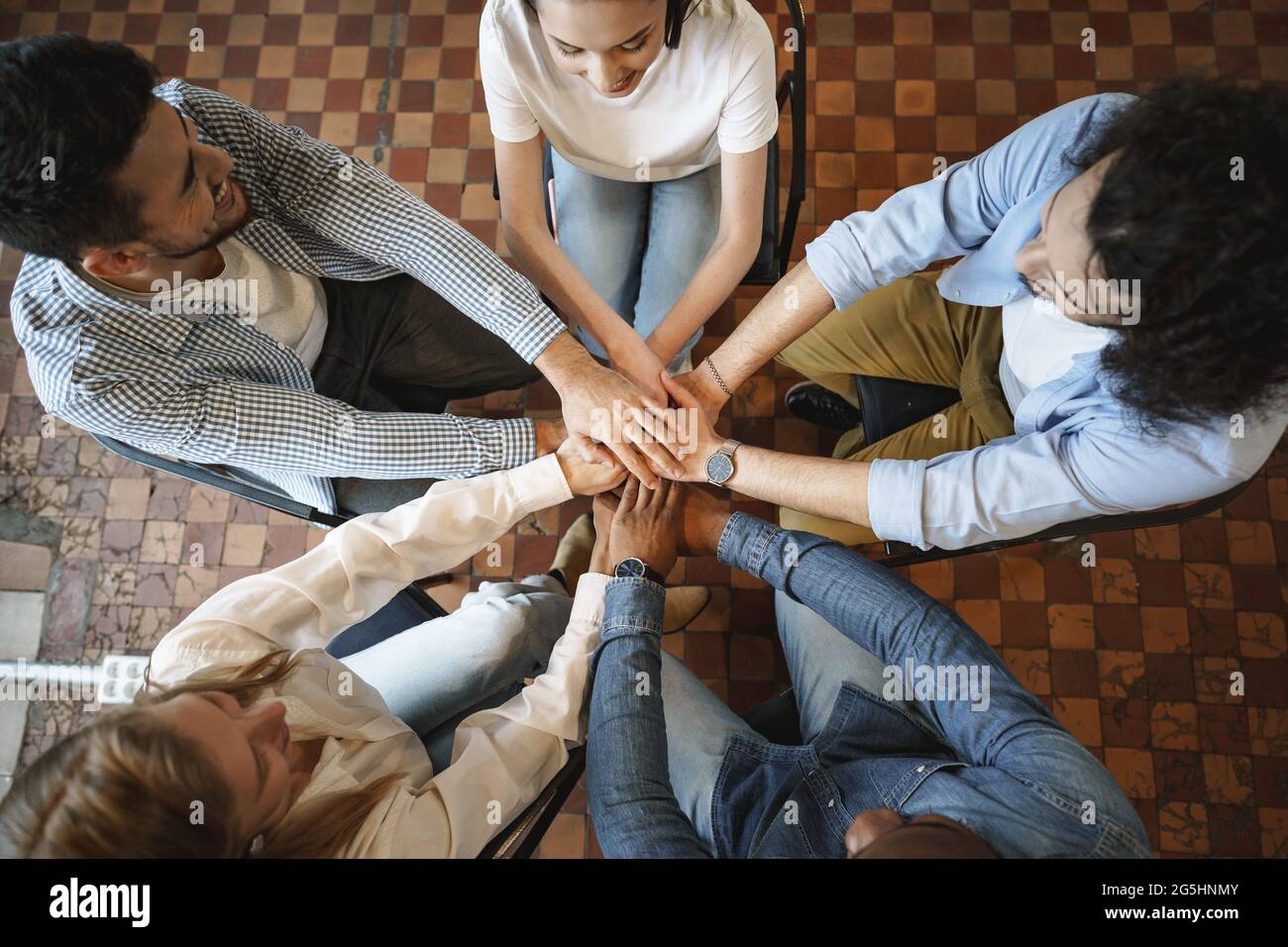 Top view of diverse people hands holding together in circle, hands ...
