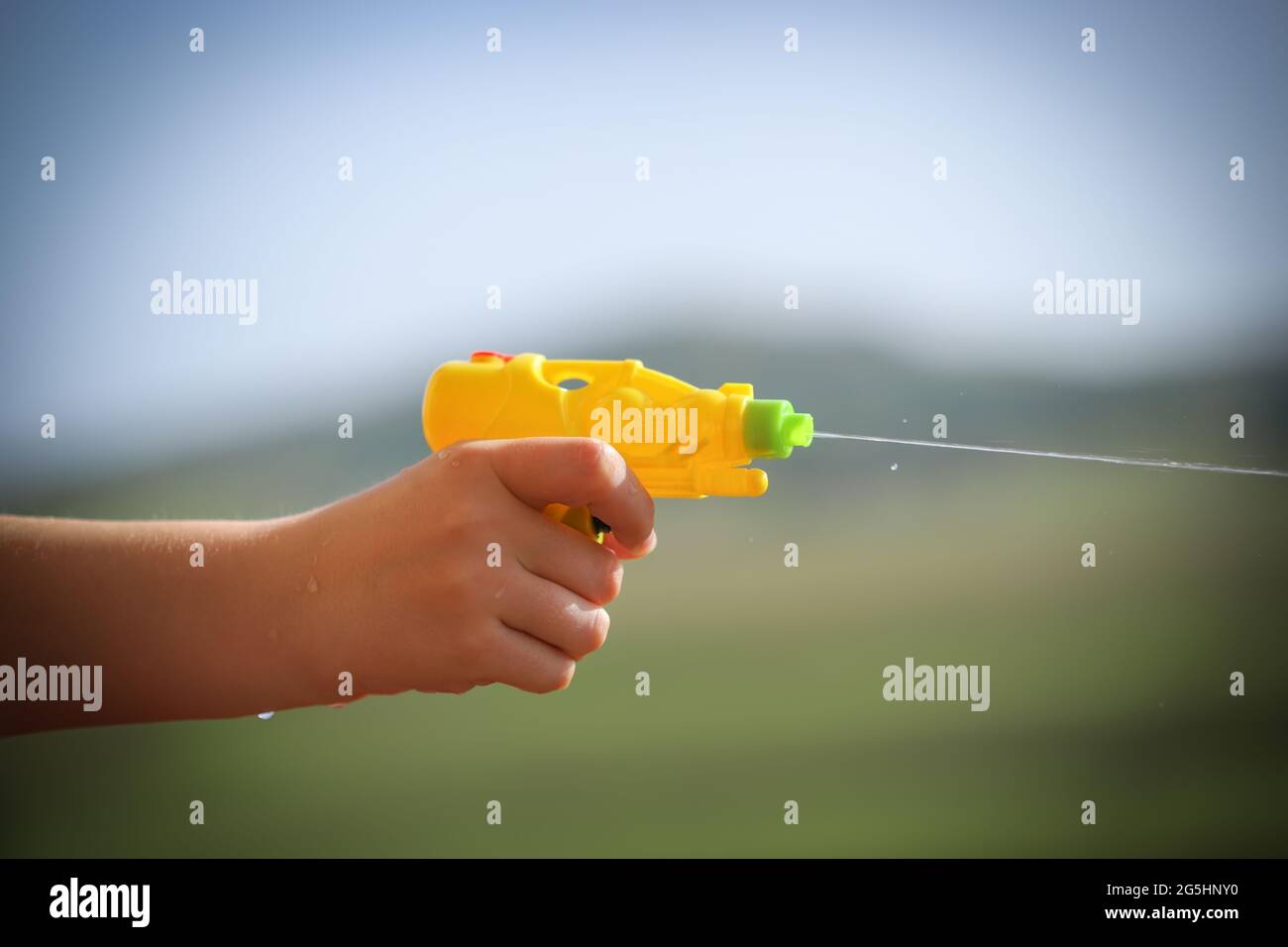 Water gun squirting water hi-res stock photography and images - Alamy