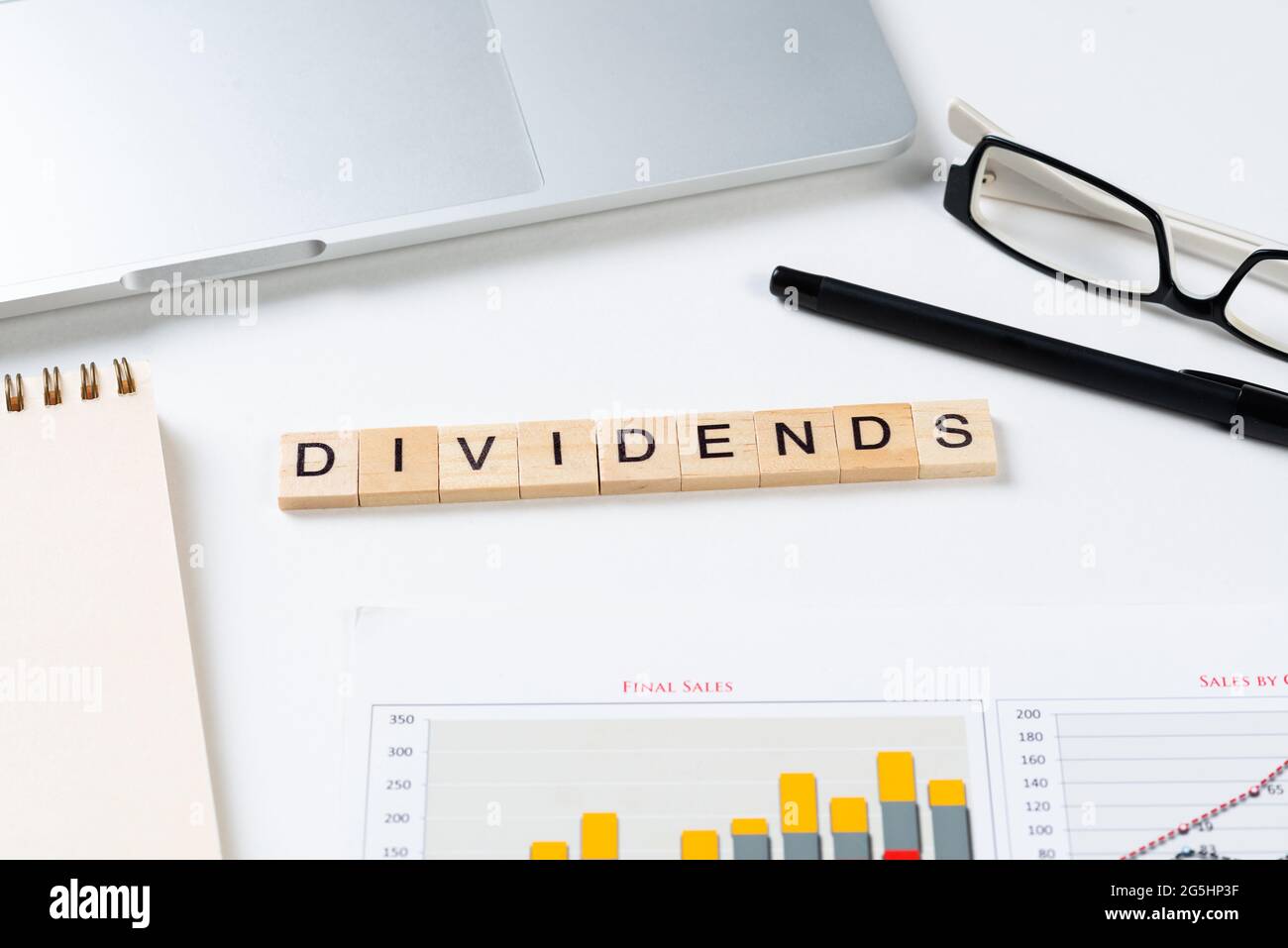 Dividends payment concept with letters Stock Photo - Alamy