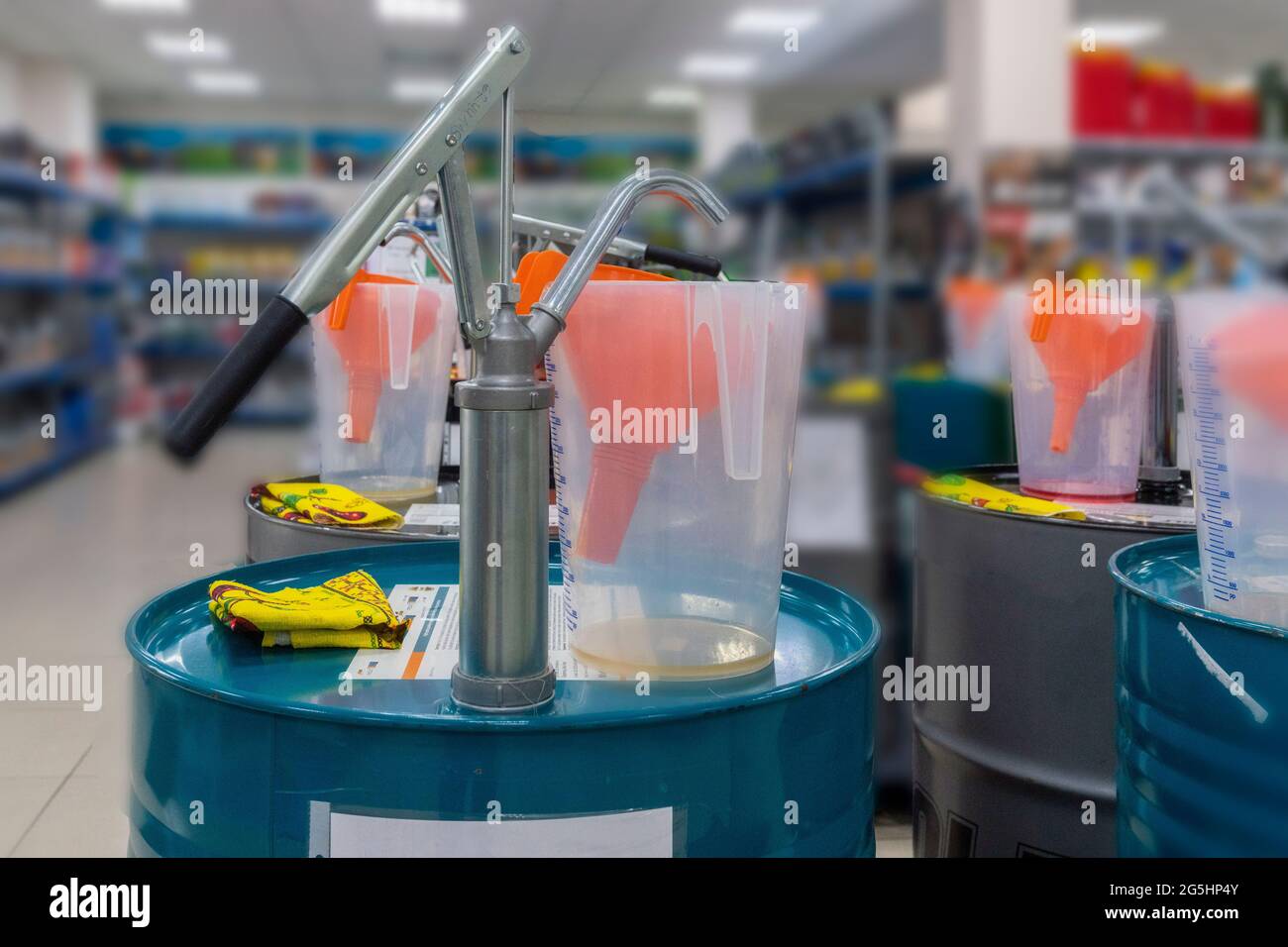 sale of engine oil on tap from barrels in the store. a barrel and a ...