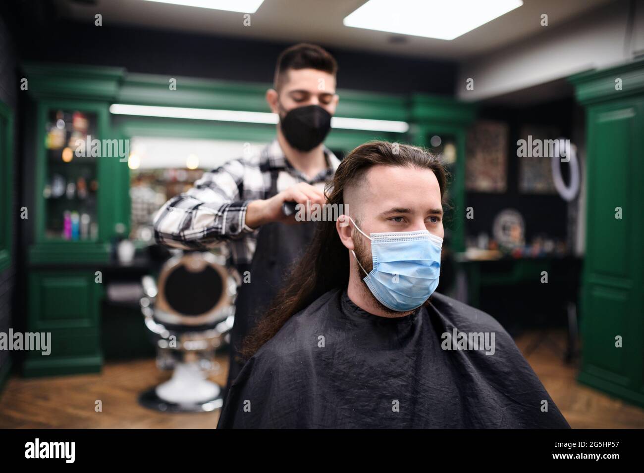 Man client visiting haidresser in barber shop, coronavirus and new ...