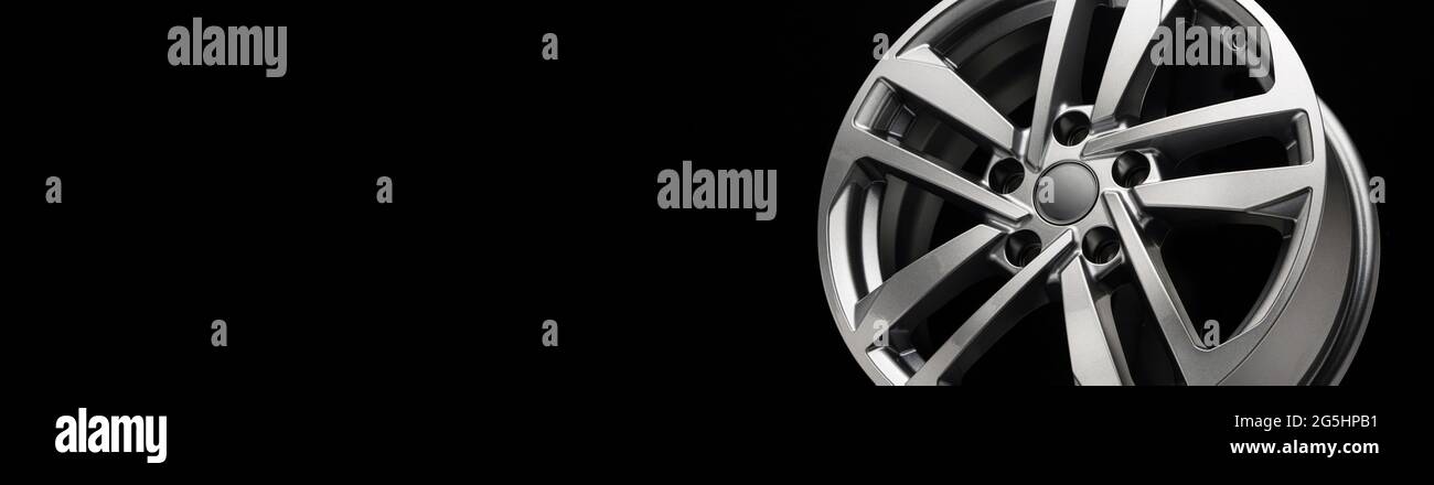 gray modern alloy wheel side view on a black background of copy space ...