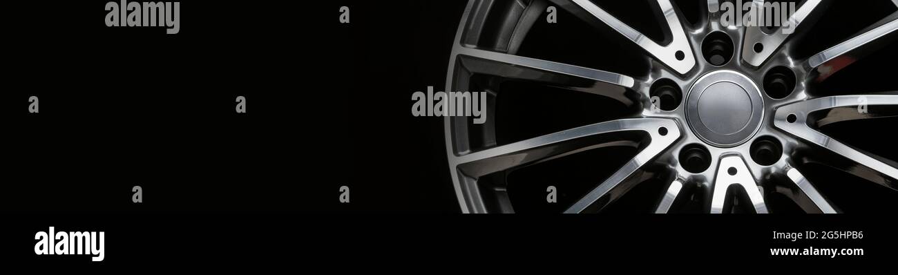 an alloy wheel banner fragment on a black background. mockup for the ...