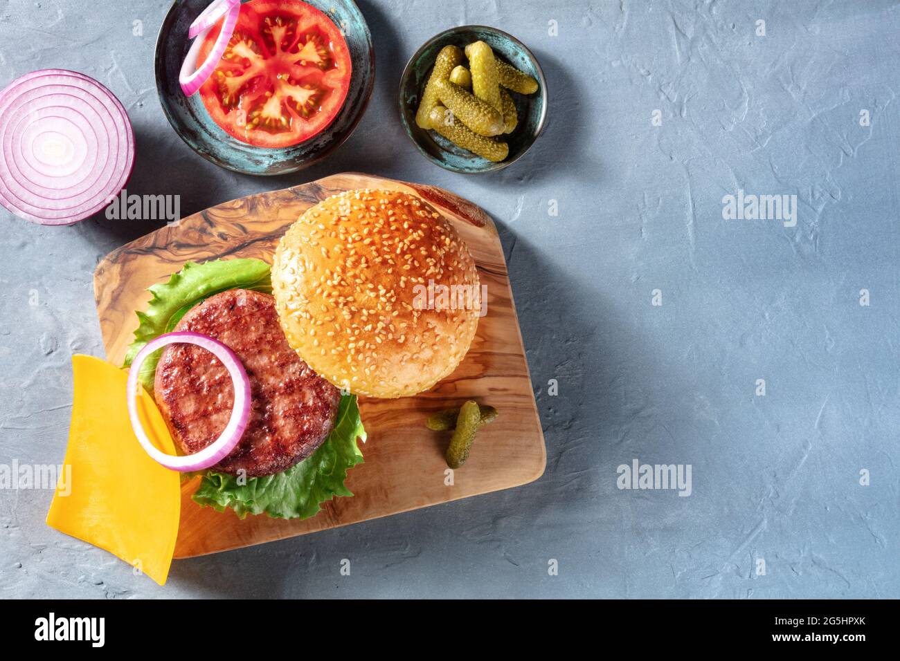 Burger ingredients with copy space, shot from above. Hamburger beef ...