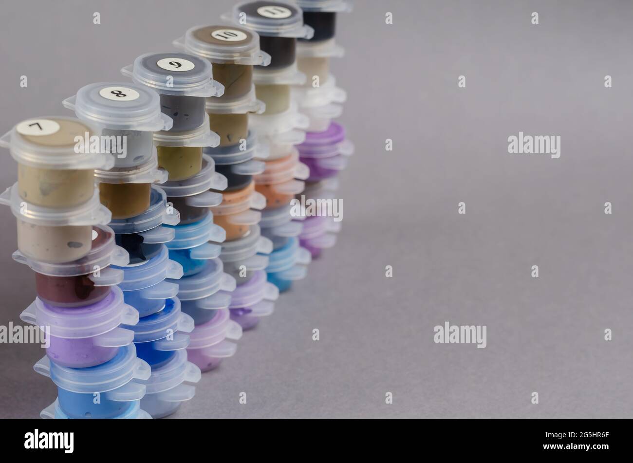 Numbered Plastic paint containers on Gainsboro color background. Set of ...